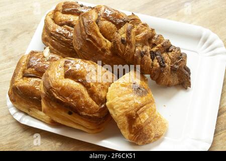 assorted chocolate croissants on a try for pastries Stock Photo - Alamy
