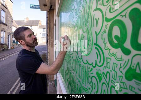 Muralist Luke Embden's Chipping Norton Library window artwork Stock ...