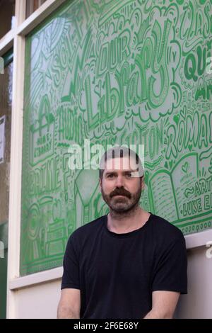 Muralist Luke Embden's Chipping Norton Library window artwork Stock ...