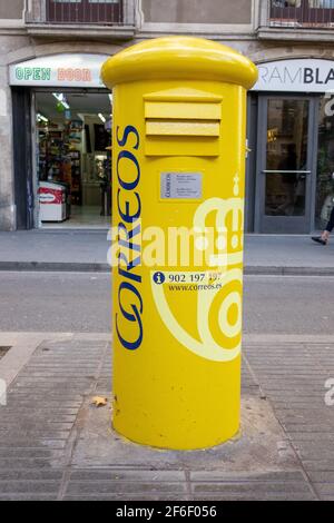 correos yellow post box barcelona catalonia spain Stock Photo - Alamy