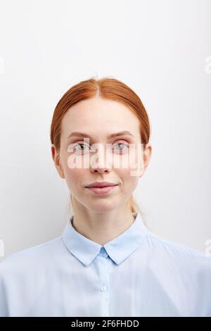 Photo of serious ginger pretty young calm woman wear headscarf isolated ...