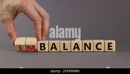 Balance or imbalance symbol. Businessman turns cubes and changes the ...