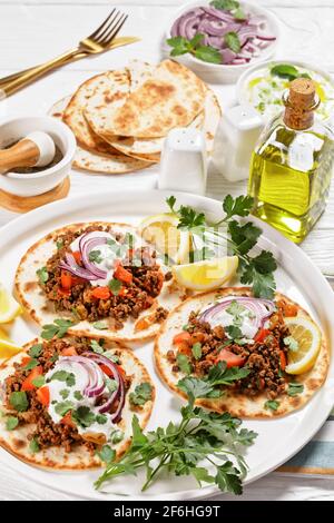 ground Lamb Flatbreads topped with yogurt, coriander leaves and red ...