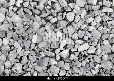 The texture of light gray granite gravel, used as a background Stock ...