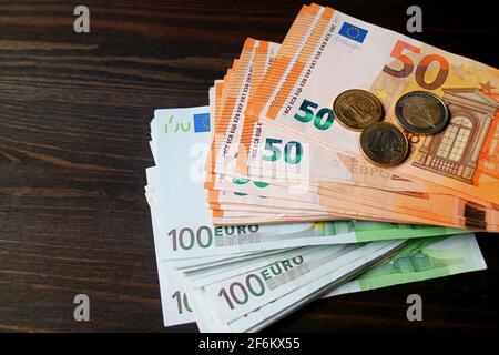 coin on wooden and brown table with copy space Stock Photo - Alamy