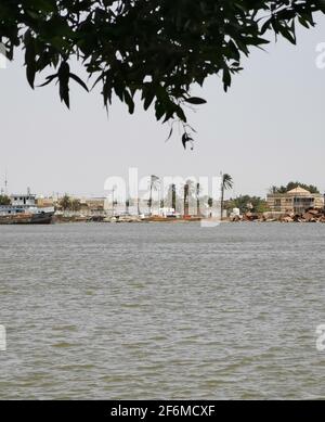 basra, Iraq - april 27, 2018: photo of boat in the river in basra city ...