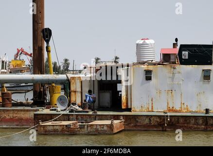 basra, Iraq - april 27, 2018: photo of boat in the river in basra city ...