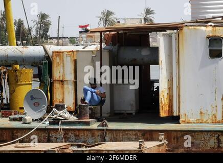 basra, Iraq - april 27, 2018: photo of boat in the river in basra city ...