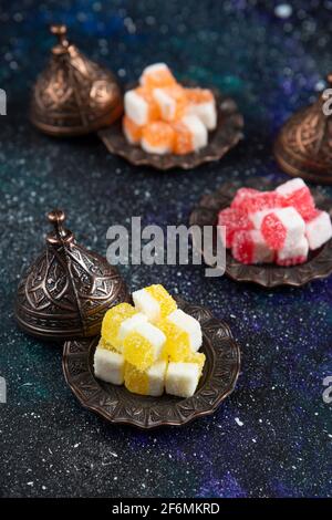 Candy crockery in a row over white background Stock Photo - Alamy