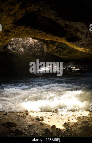 Spectacular Mermaid Caves with sunlight piercing through hole in ...