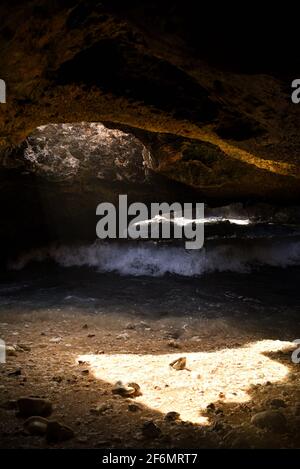 Spectacular Mermaid Caves with sunlight piercing through hole in ...