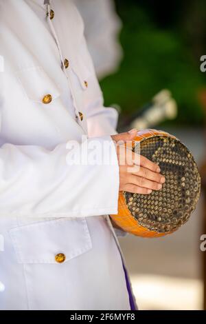 Spike fiddle, Tro, being played by a musician at a Cambodian wedding ...