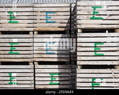Wooden boxes marked with letter E Stock Photo - Alamy