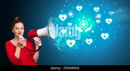 Young person with megaphone and healthcare icon Stock Photo - Alamy
