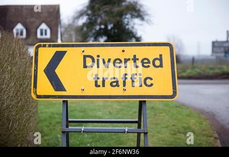 Diverted traffic sign. Road sign showing a diversion all the way around ...