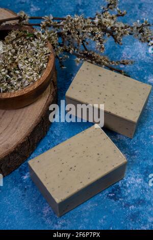 Aleppo soap and dray Laurus nobilis flower in a wooden plate Stock ...