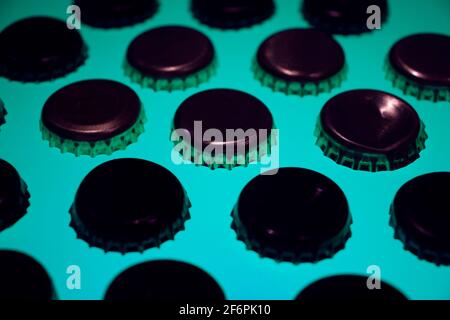 beer caps on blue background Stock Photo - Alamy