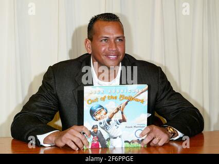 Alex Rodriguez ("A-Rod") poses for pictures before signing copies of ...