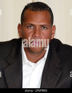 Alex Rodriguez ("A-Rod") poses for photographers before signing copies ...