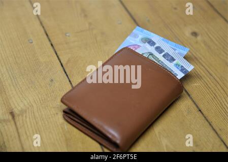 german euro bank notes on the floor with various items like a wallet, a ...