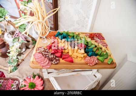 Slicing different types of cheese and meat Stock Photo - Alamy