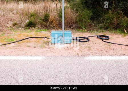 Black pneumatic tube along the road to measure speed and number of ...