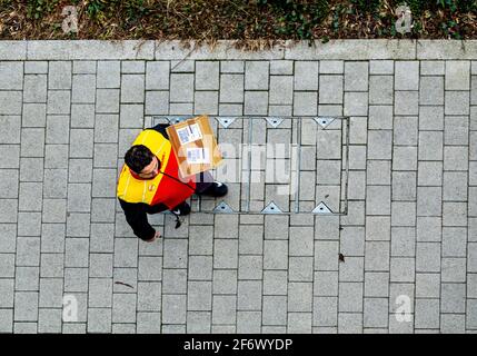 Express delivery service worker in medical mask with big food bag and ...