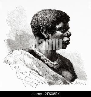 Tribal woman in typical white sari with basket on head. Santhal tribe ...