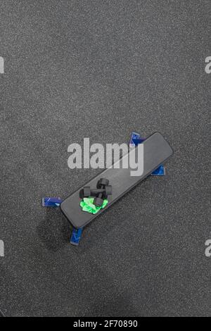 Aerial view of weight bench and dumbbells in gym Stock Photo - Alamy