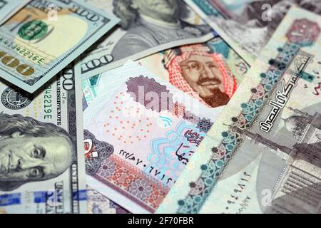 American dollars, Egyptian pounds and Saudi Arabia Riyals banknotes ...