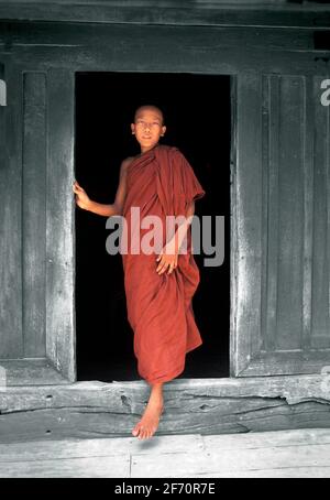 A Novice monk steps out from afternoon prayers. Bagaya Kyaung, Ava ...
