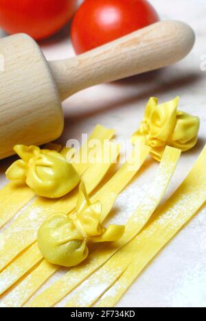 Tagliatelle and filled dough beads, ribbon noodles, pearl al basilico ...
