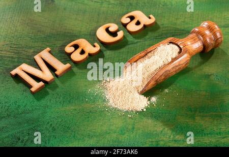 Word maca in wooden letters - Dry Organic Maca Powder. Lepidium meyenii ...