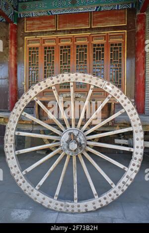 Covered-two wheeled-seatless-springless-double pole wooden cart. Dafo ...