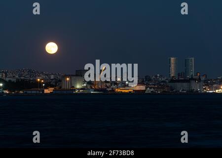 full moon rising over Istanbul skyline Stock Photo - Alamy