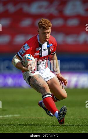 Harvey Livett (20) of Salford Red Devils leaves the pitch with an ...