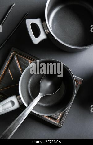 Cooking pots on dark background Stock Photo - Alamy