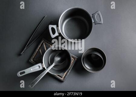 Cooking pots on dark background Stock Photo - Alamy