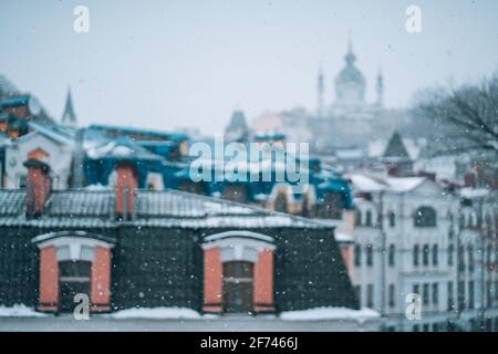 Copious snowfall over the city with the roofs Stock Photo - Alamy