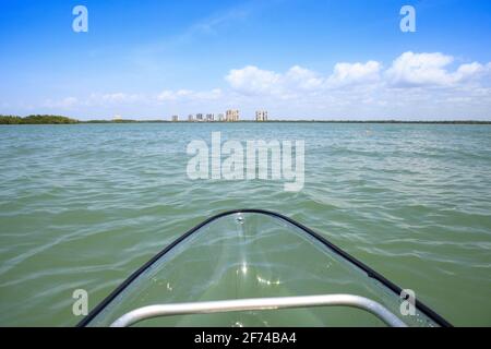Clear kayak forges through the waterway of Lovers Key in Bonita Springs ...