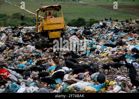 Tractor dumping trash in dumping ground in Pushkar, Rajasthan, India ...