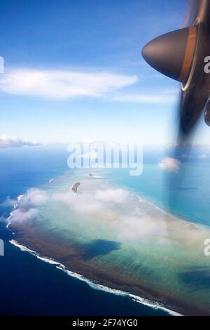 View from the airplane on the coral reef surrounding Rodrigues island ...
