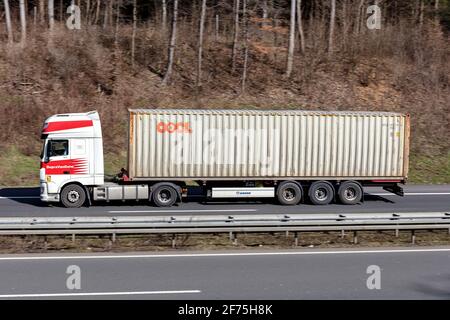 DAF XF truck with OOCL container on motorway Stock Photo - Alamy
