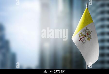 A small Vatican flag on an abstract blurry background Stock Photo - Alamy