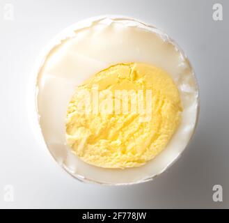 Hard-boiled egg cut in half isolated on white with clipping path ...
