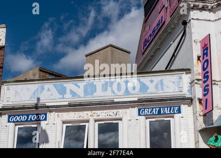Old shop sign uncovered in Southend on Sea, Essex, UK. Van Looys ...