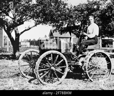 Henry Ford at the controls of one of his first tractors powered by a ...