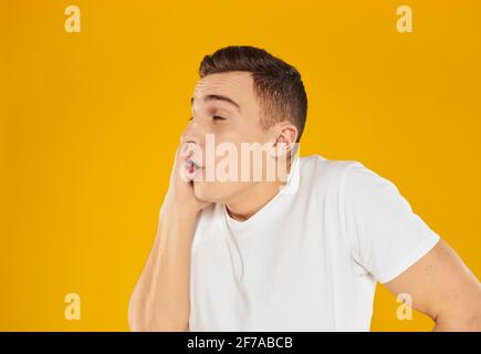 emotional man holding a white banner design orange background Stock ...