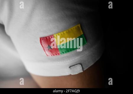Patch of the national flag of the Guinea on a white t-shirt Stock Photo ...