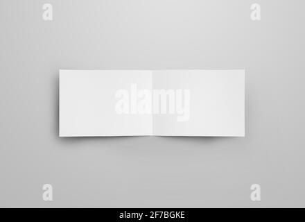 white paper bifold brochure mockup on yellow background Stock Photo - Alamy